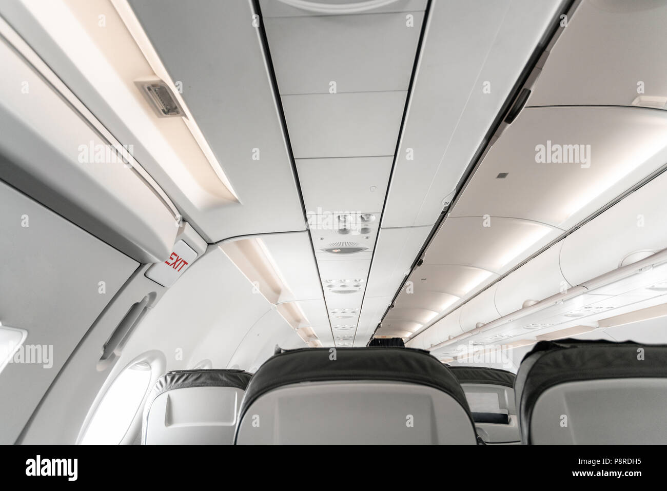 Emergency exit on an aircraft, view from inside of the plane. Empty ...