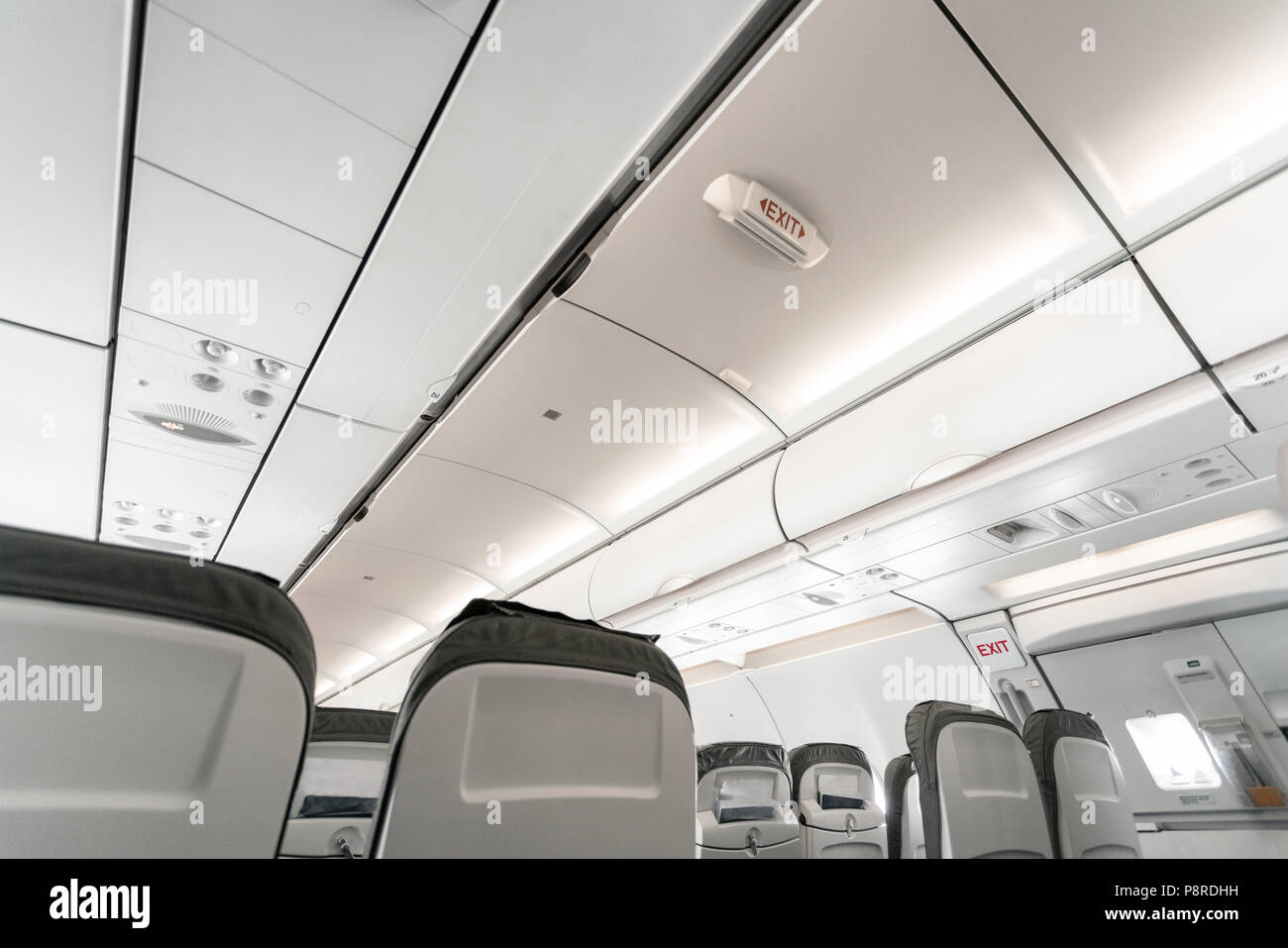 Emergency exit on an aircraft, view from inside of the plane. Empty ...