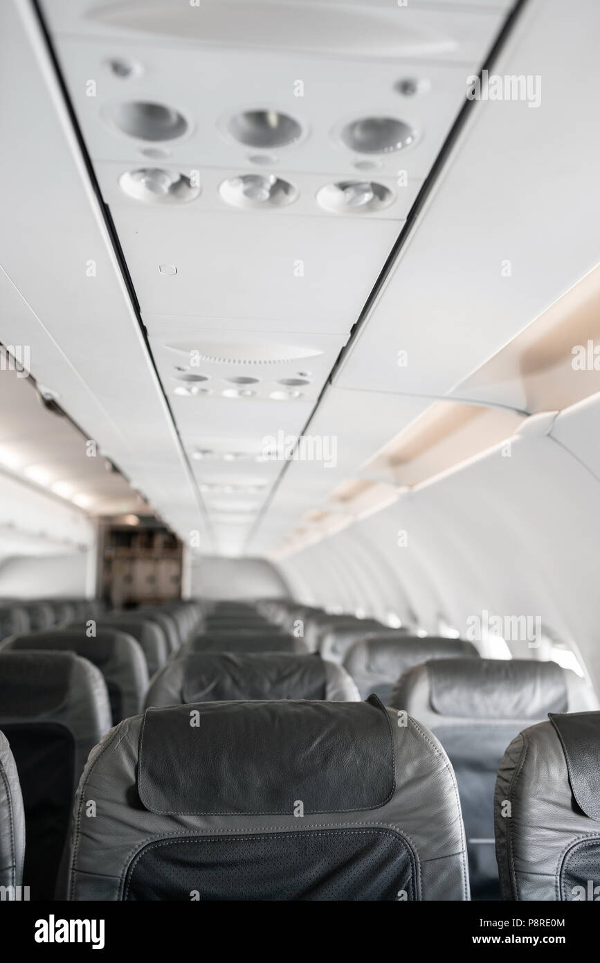 Empty airplane seats in the cabin. Modern Airplane seats in perspective ...