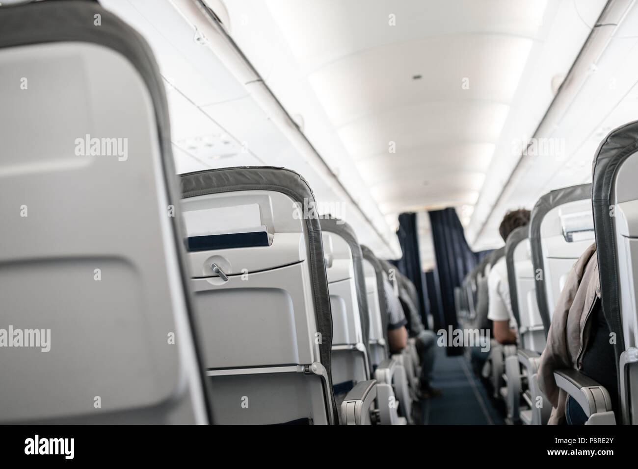 Empty airplane seats in the cabin. Modern Airplane seats in perspective ...