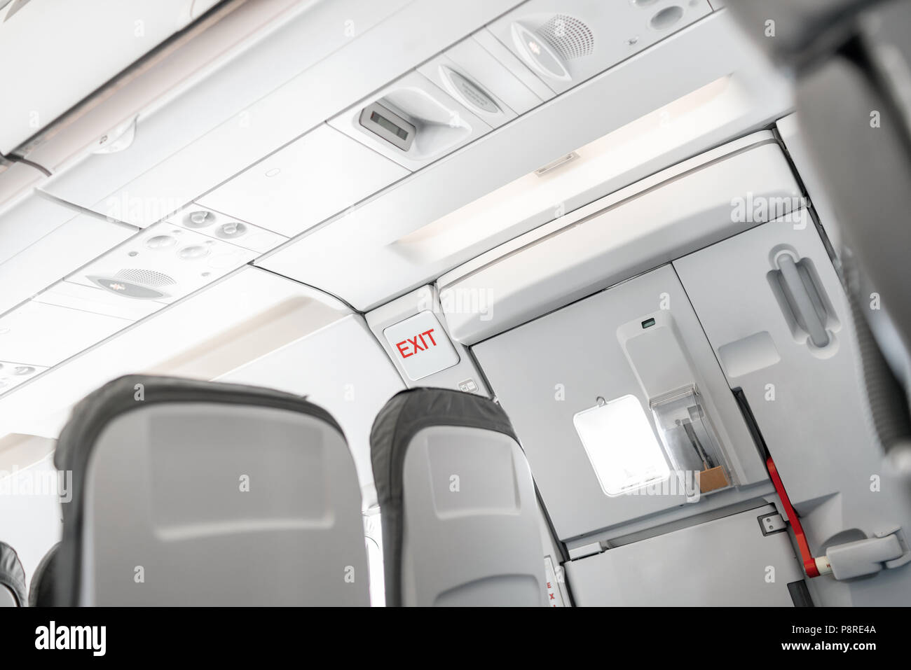 Emergency exit on an aircraft, view from inside of the plane. Empty ...