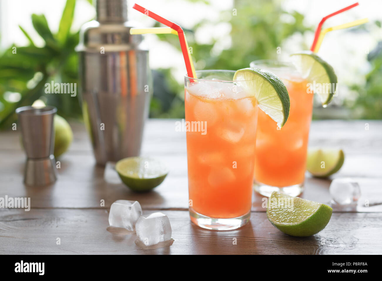Zombie Cocktail with Rum, garnished with lime. Cold sweet summer fruit ...