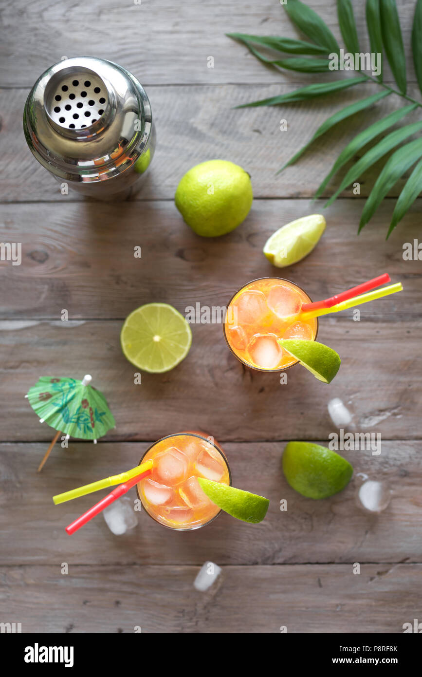 Zombie Cocktail with Rum, garnished with lime. Cold sweet summer fruit ...