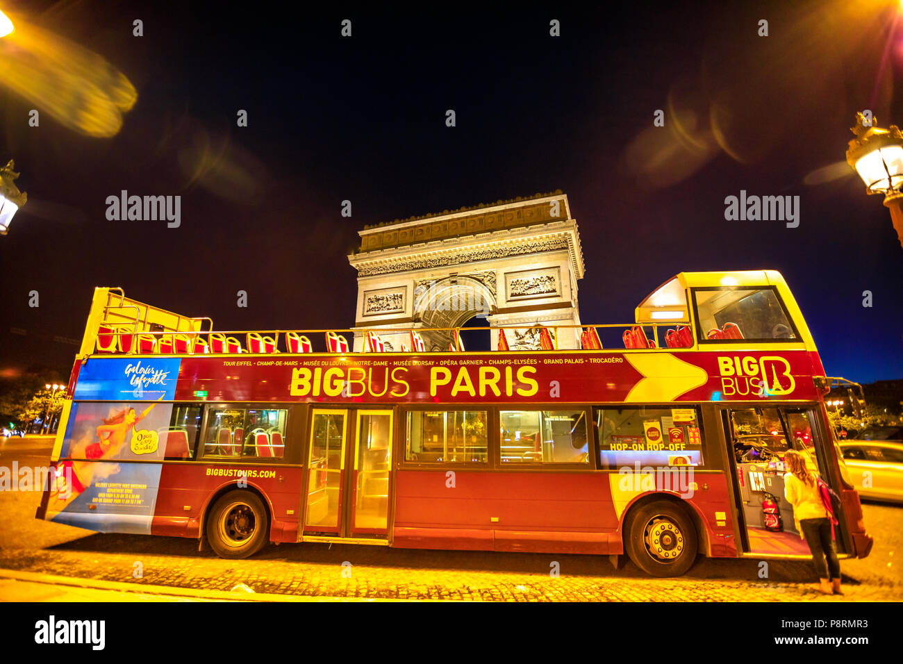Paris, France - July 2, 2017: touristic bus at Champs Elysees with Arc ...