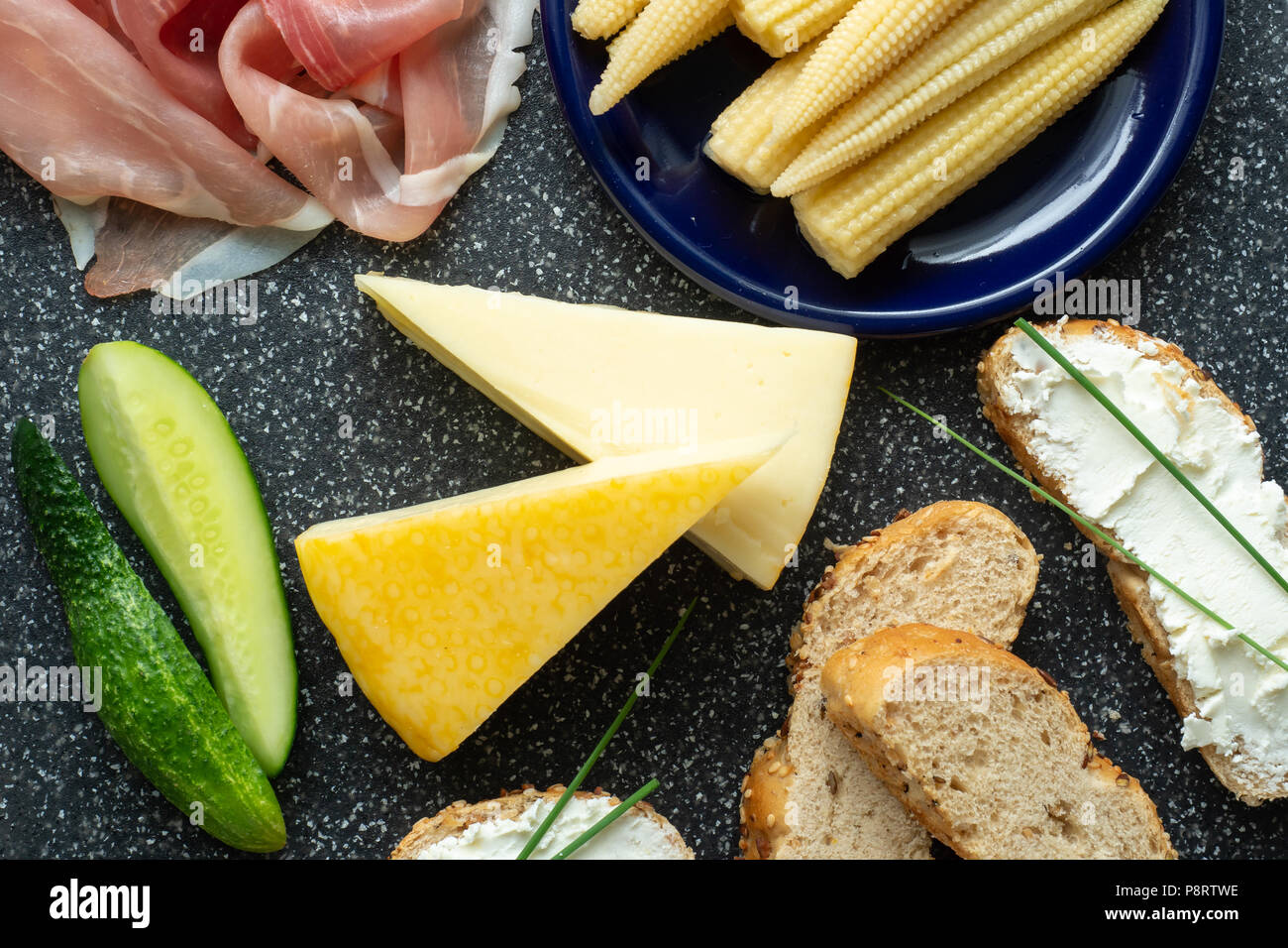 Cold appetizer. Cold cuts. Spicy food on black background, top view ...