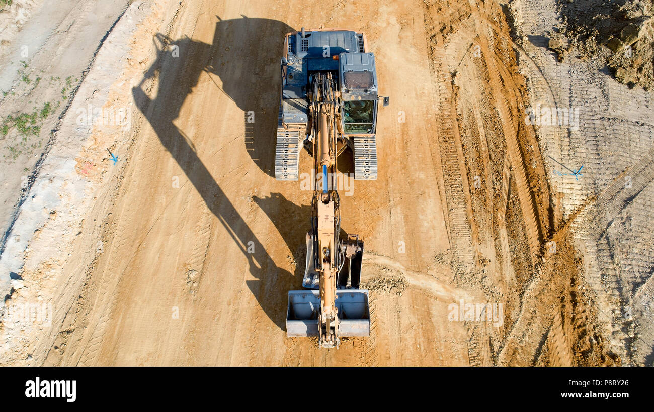 Aerial photo of a backhoe on a construction site Stock Photo - Alamy