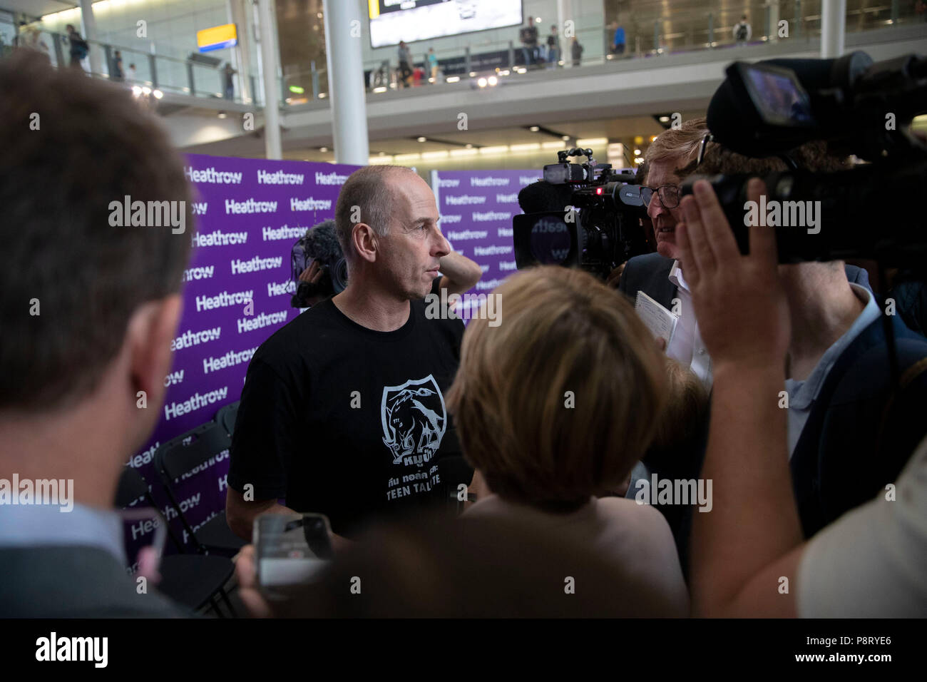 Diver Rick Stanton, centre, from the rescue mission, which helped to ...