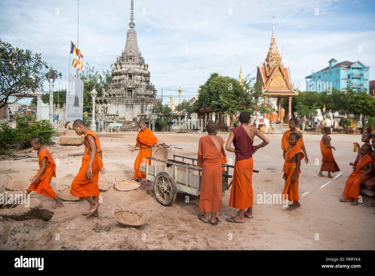 young monks wort at a construction for a new building at the Wat ...
