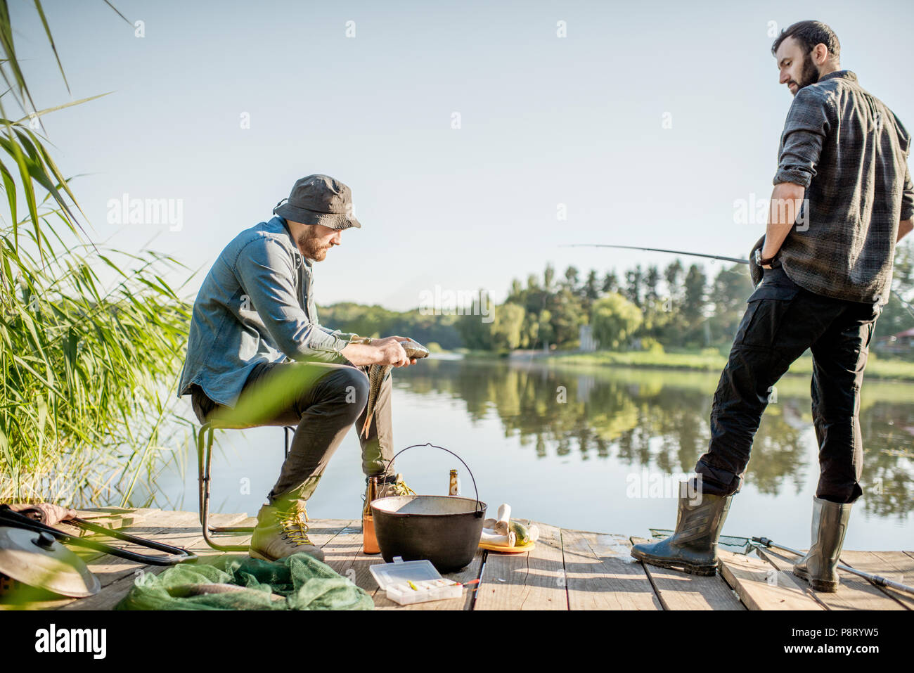 Man relaxing in chair fishing hi-res stock photography and images - Alamy