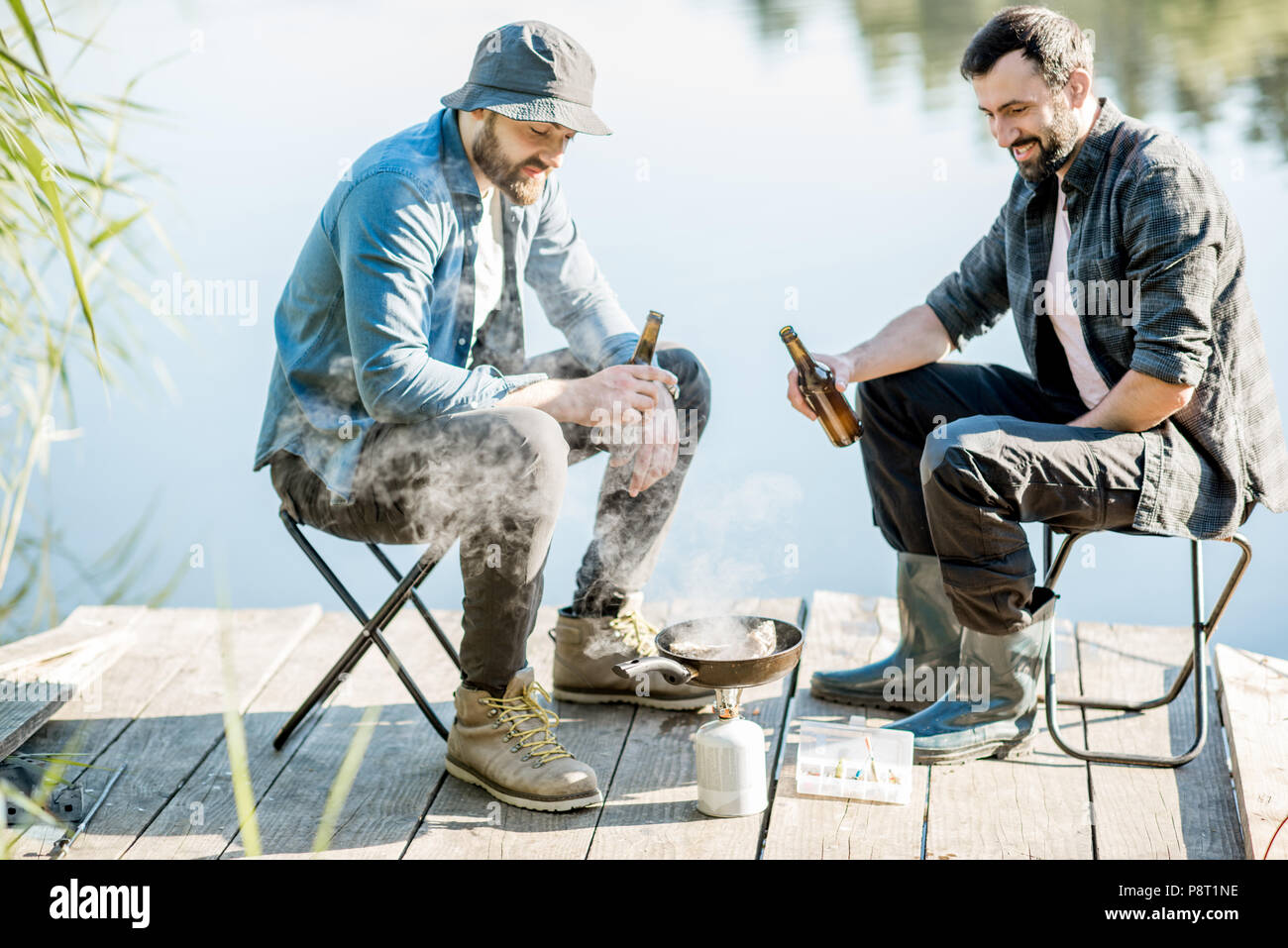 Man Sitting In Chair Fishing High Resolution Stock Photography and ...