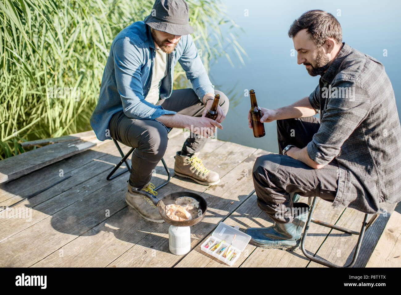 Man Sitting In Chair Fishing High Resolution Stock Photography and ...