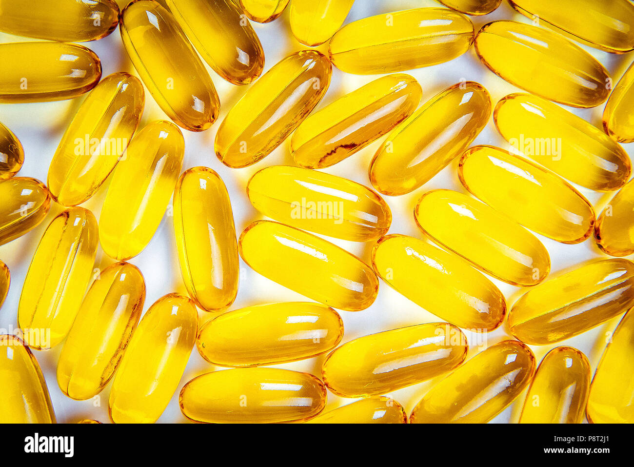 Close up of capsules Omega 3 on white background. Top view, high ...