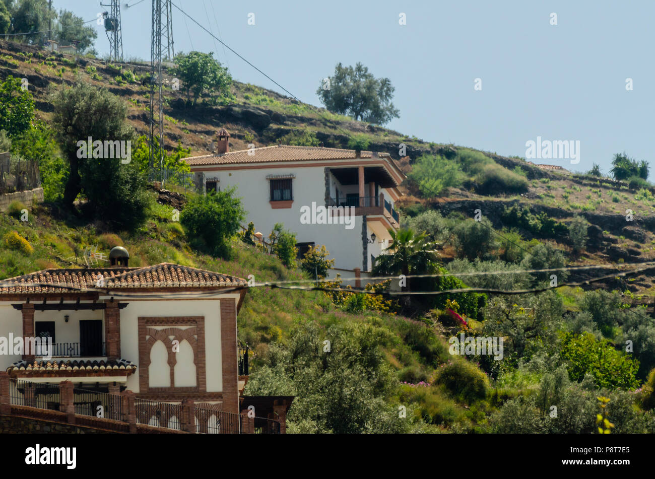 typical spanish village houses and farmland in the hills of andalusia ...