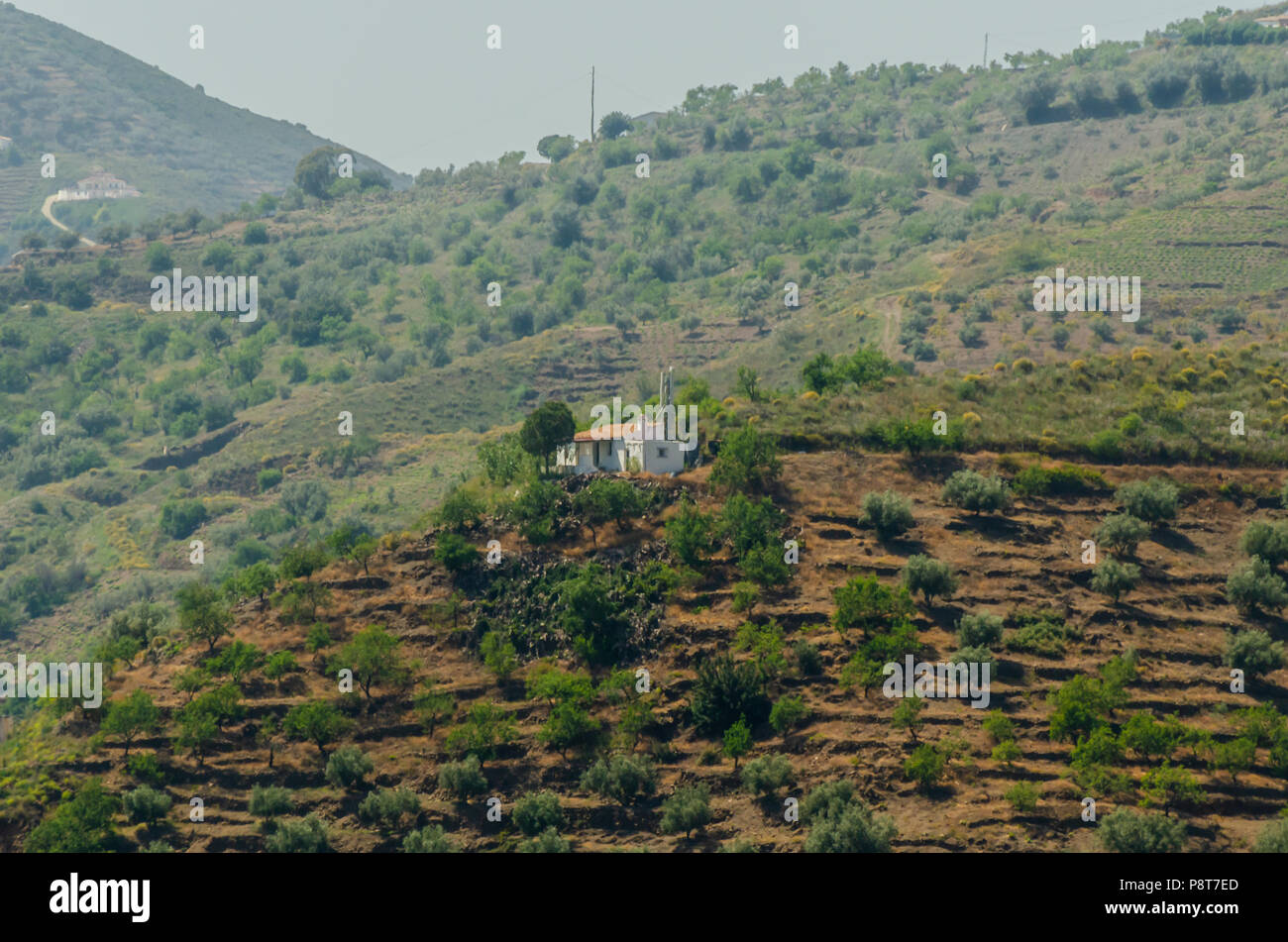 typical spanish village houses and farmland in the hills of andalusia ...