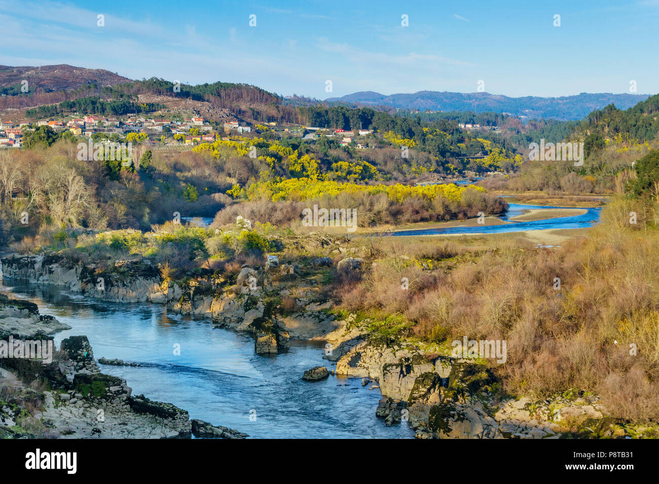 Blue water of Minho river in Arbo town Stock Photo - Alamy