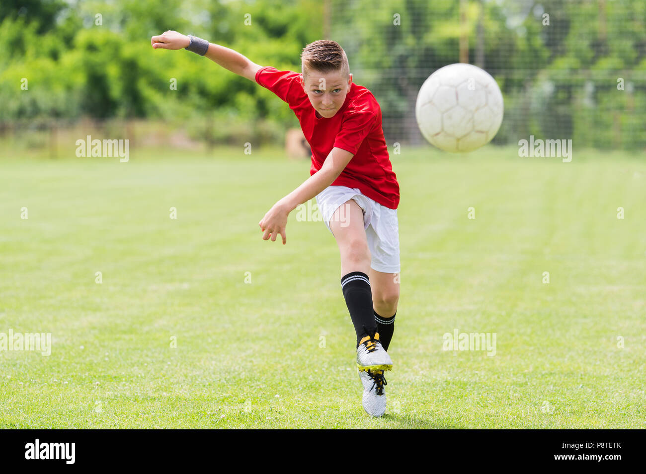 Little Boy Shooting at Goal Stock Photo - Alamy