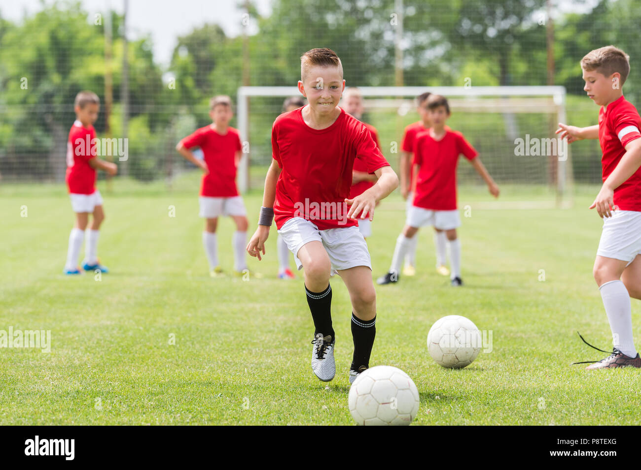 Little Boy Shooting at Goal Stock Photo - Alamy