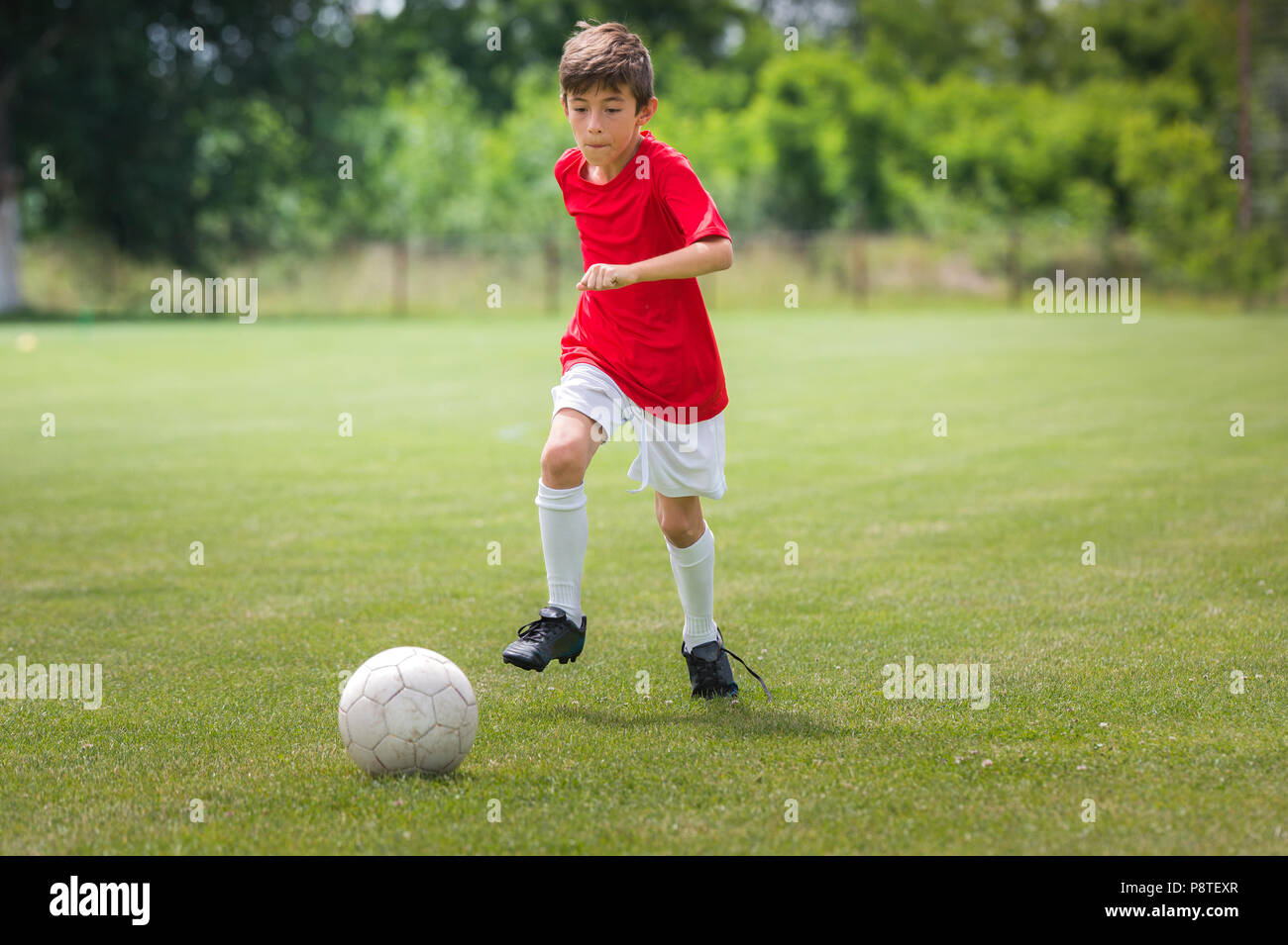 Little Boy Shooting at Goal Stock Photo - Alamy