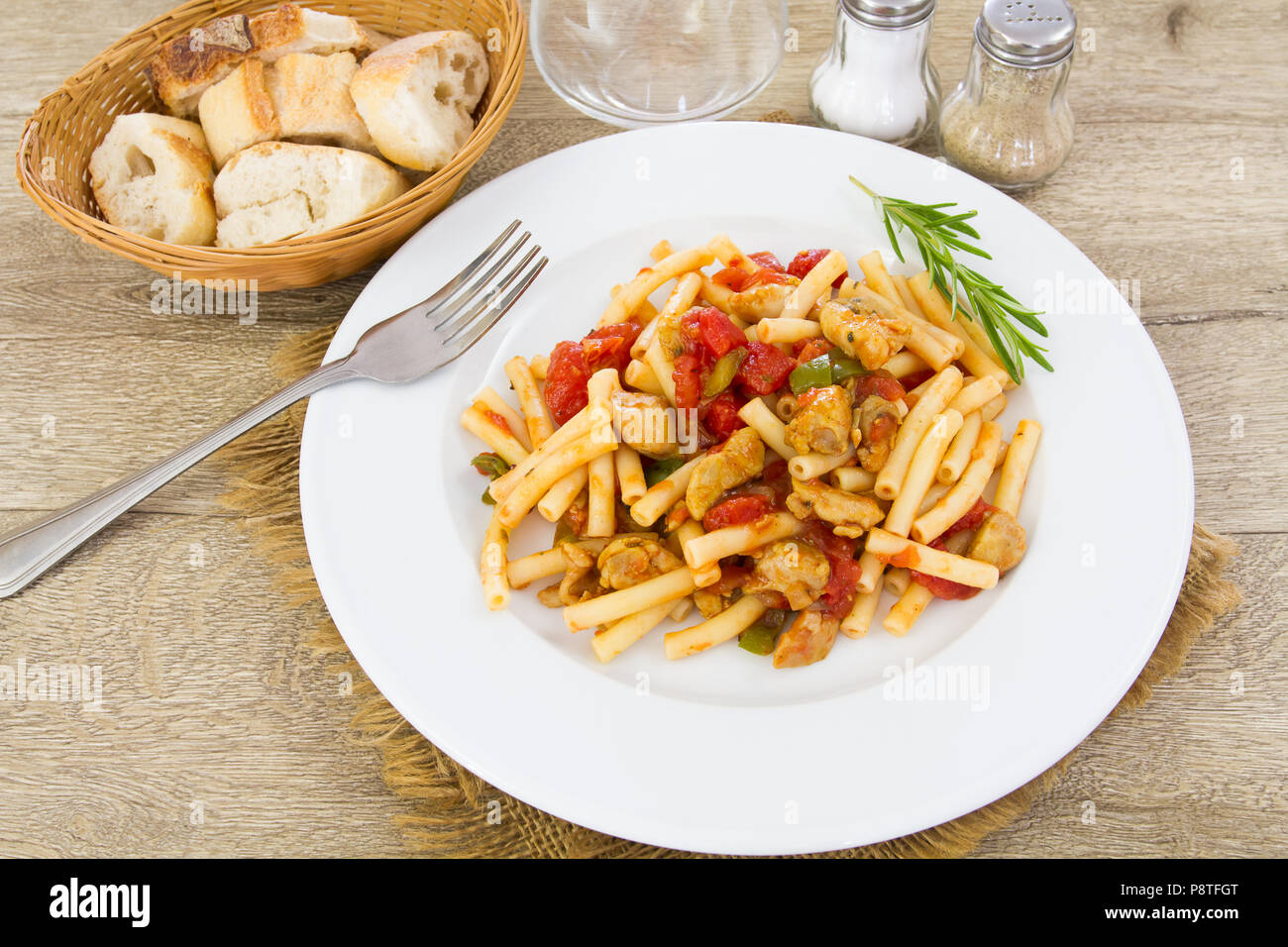 Sautéed pork and Provencal pasta Stock Photo - Alamy