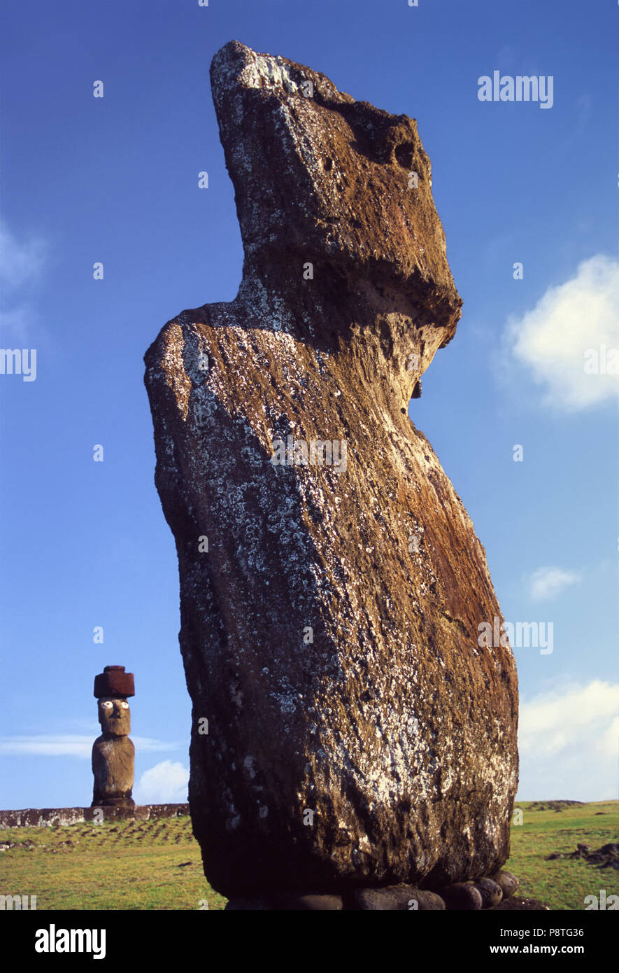 Ahu Tahai with two moai statues one distant moai with top knot, Easter ...