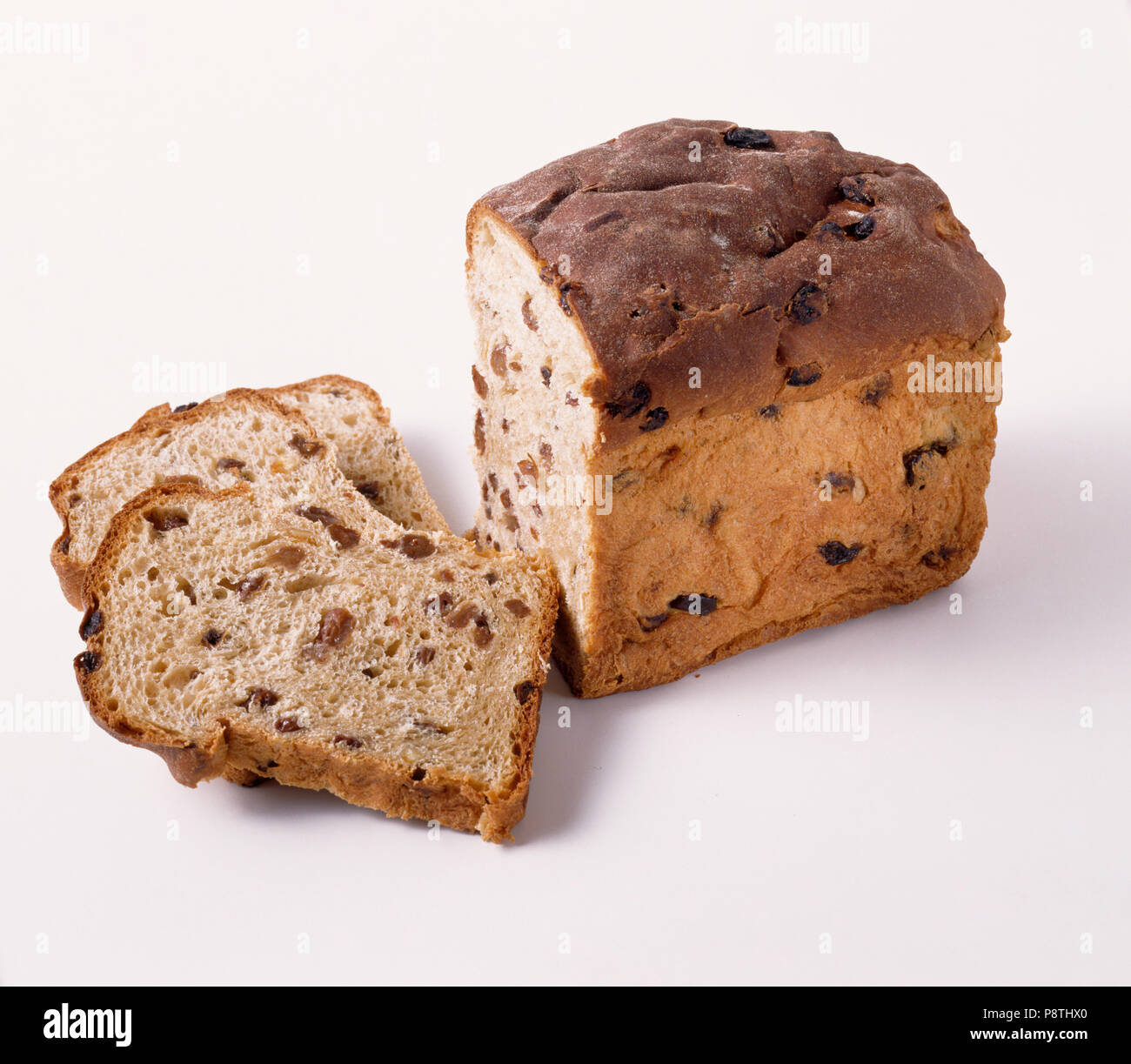 Close-up of loaf of currant bread and two slices Stock Photo - Alamy