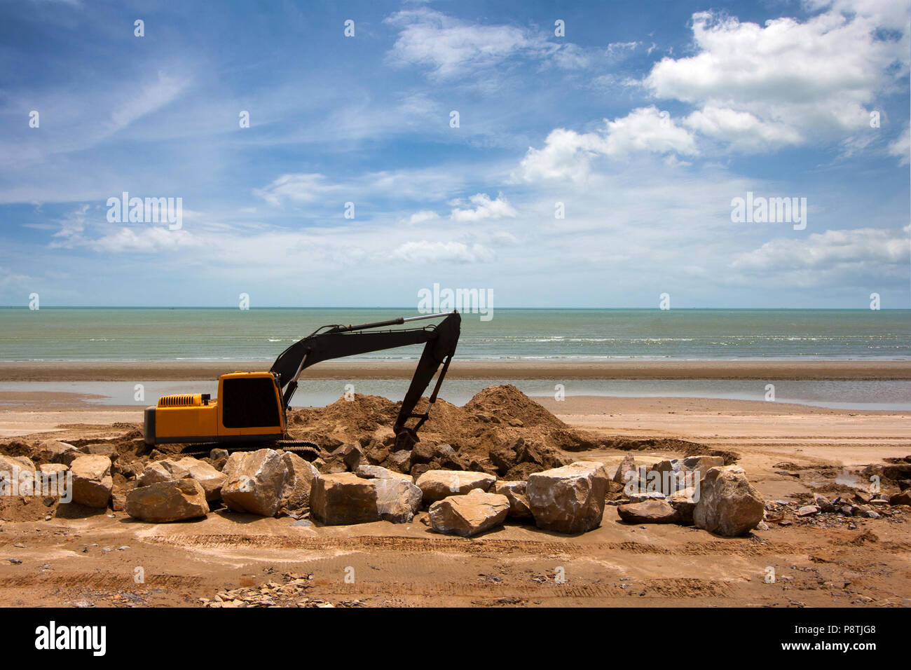 excavator machine doing earthmoving work at sand quarry Stock Photo - Alamy