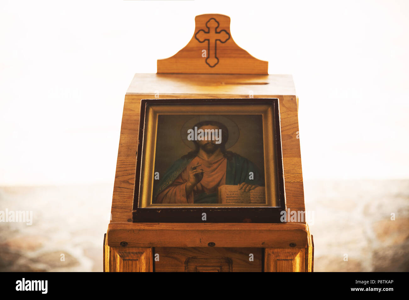 Details from an Orthodox church, wooden charity table with Jesus Christ ...