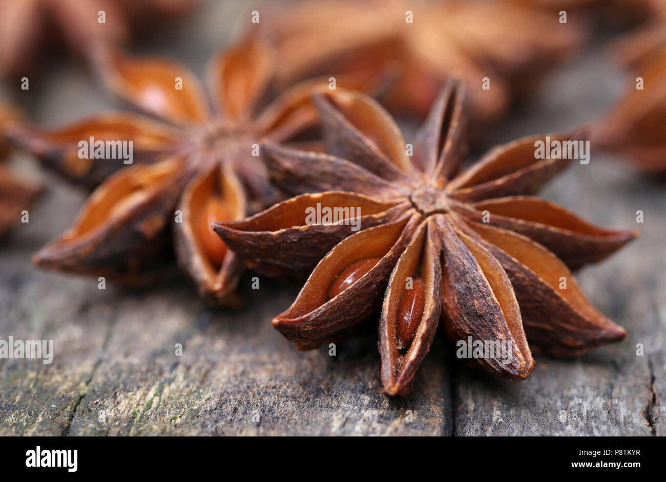 Aromatic star anise on timber surface Stock Photo - Alamy