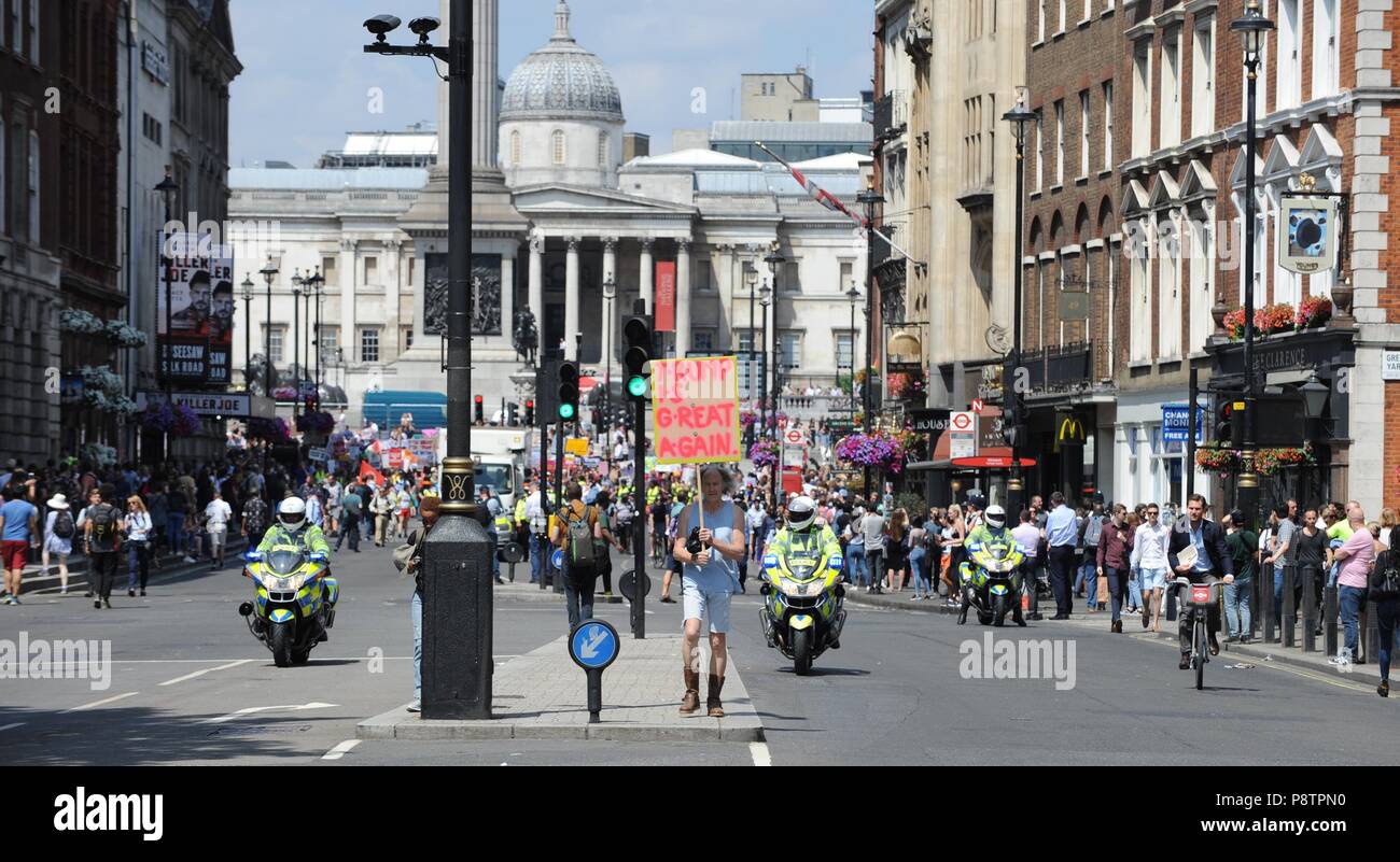 London, England, 13th July 2018. A lone Trump supporter walks ahead of ...