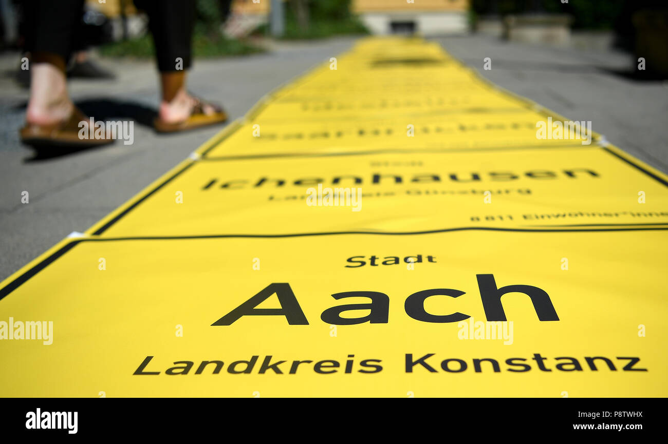 Germany, Berlin. 13th July, 2018. Prints of town signs care placed on a ...