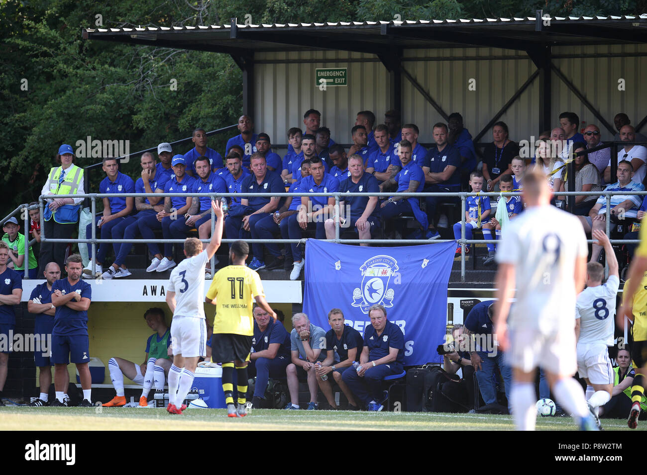 Cardiff city manager Neil Warnock sits in the dugout as he and most of ...