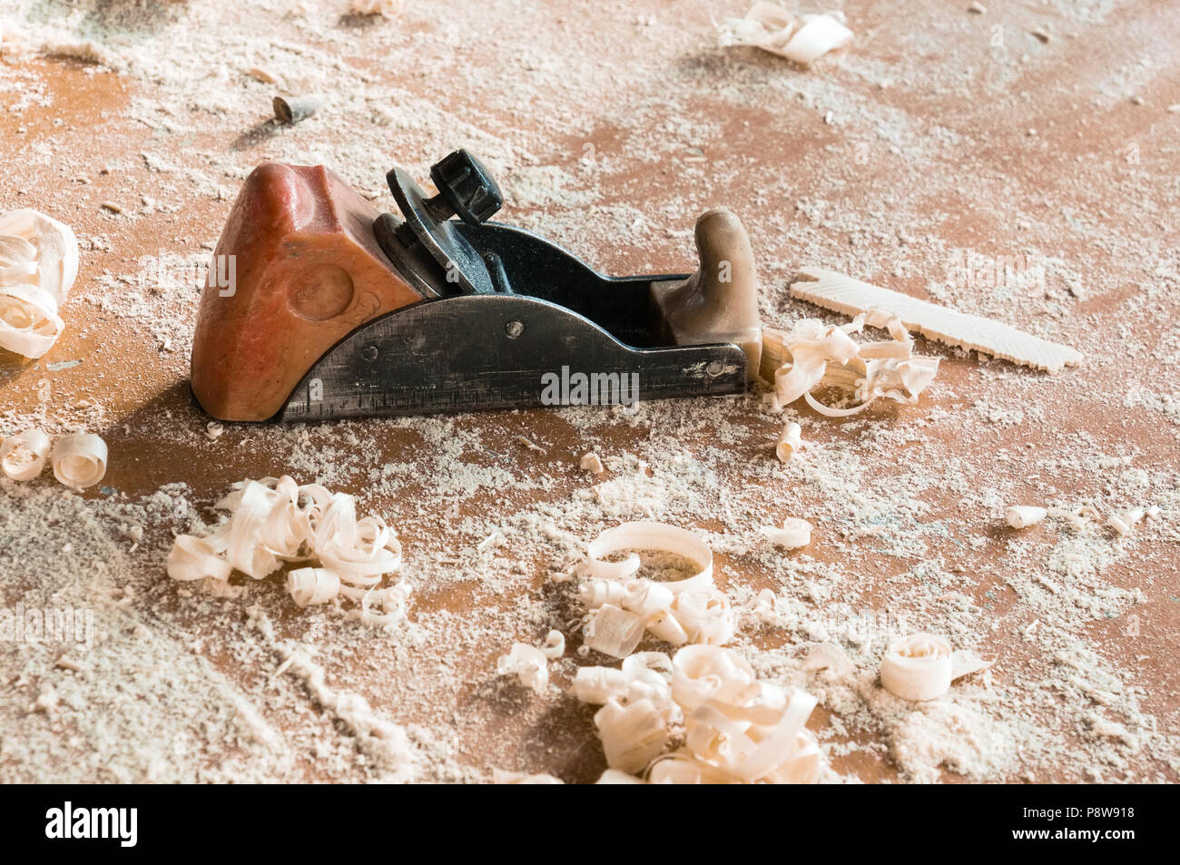 Old traditional carpentry tools with shavings. A hammer and a jointer ...