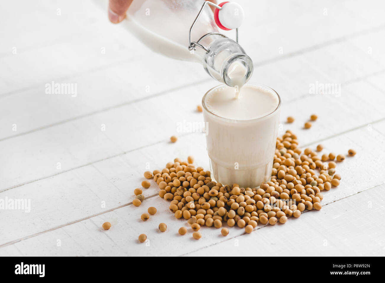 Soy milk In a glass On the white table Health drink Stock Photo - Alamy