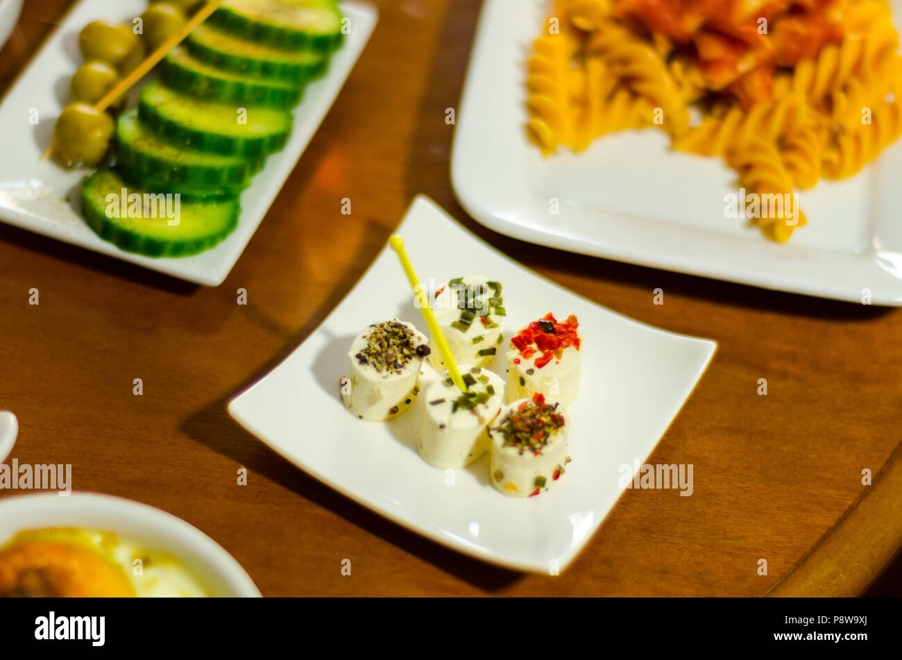 Set with different appetizers in small portions, healthy and delicious ...