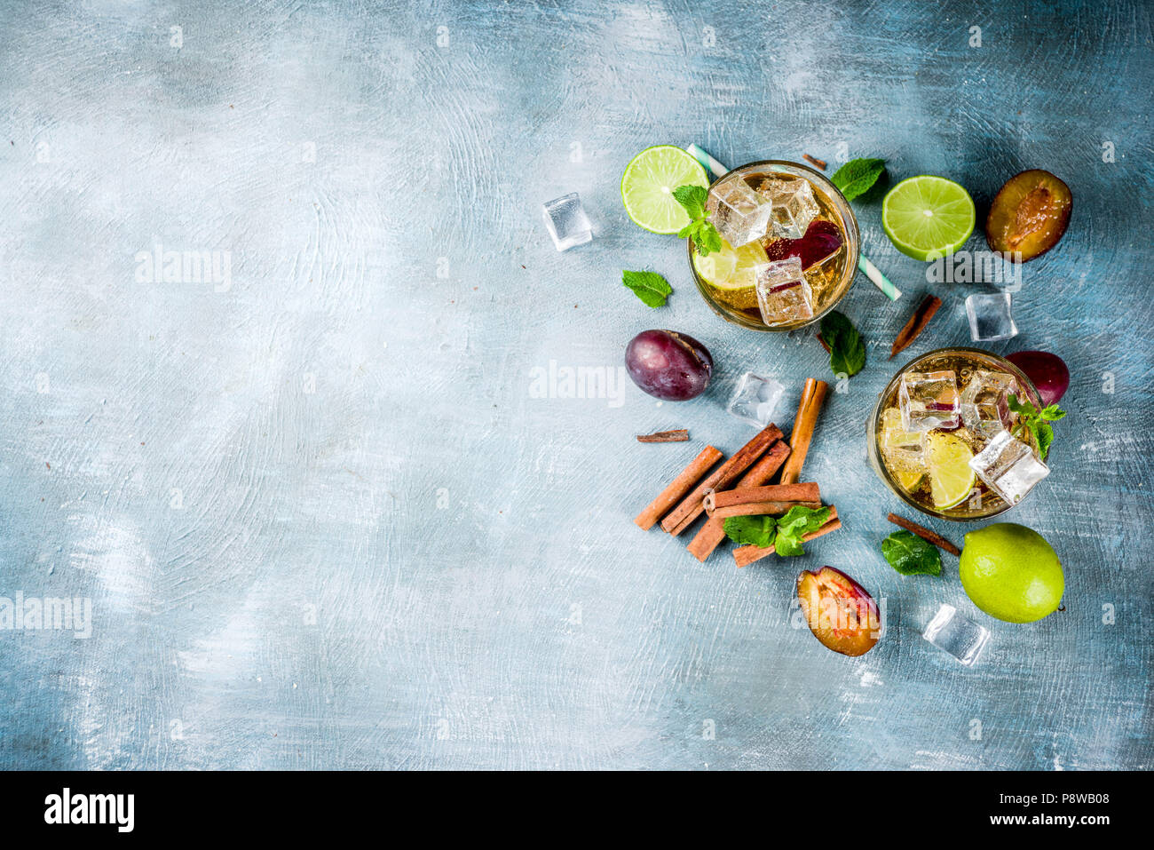 Summer iced refreshment drink. Cinnamon and plum lemonade cocktail ...