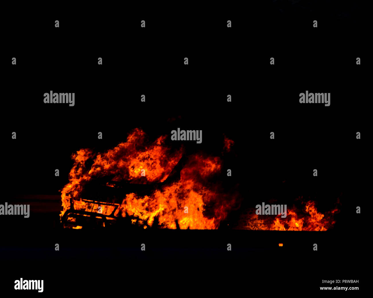 burning car on the road at night, a tragic accident ending with the ...