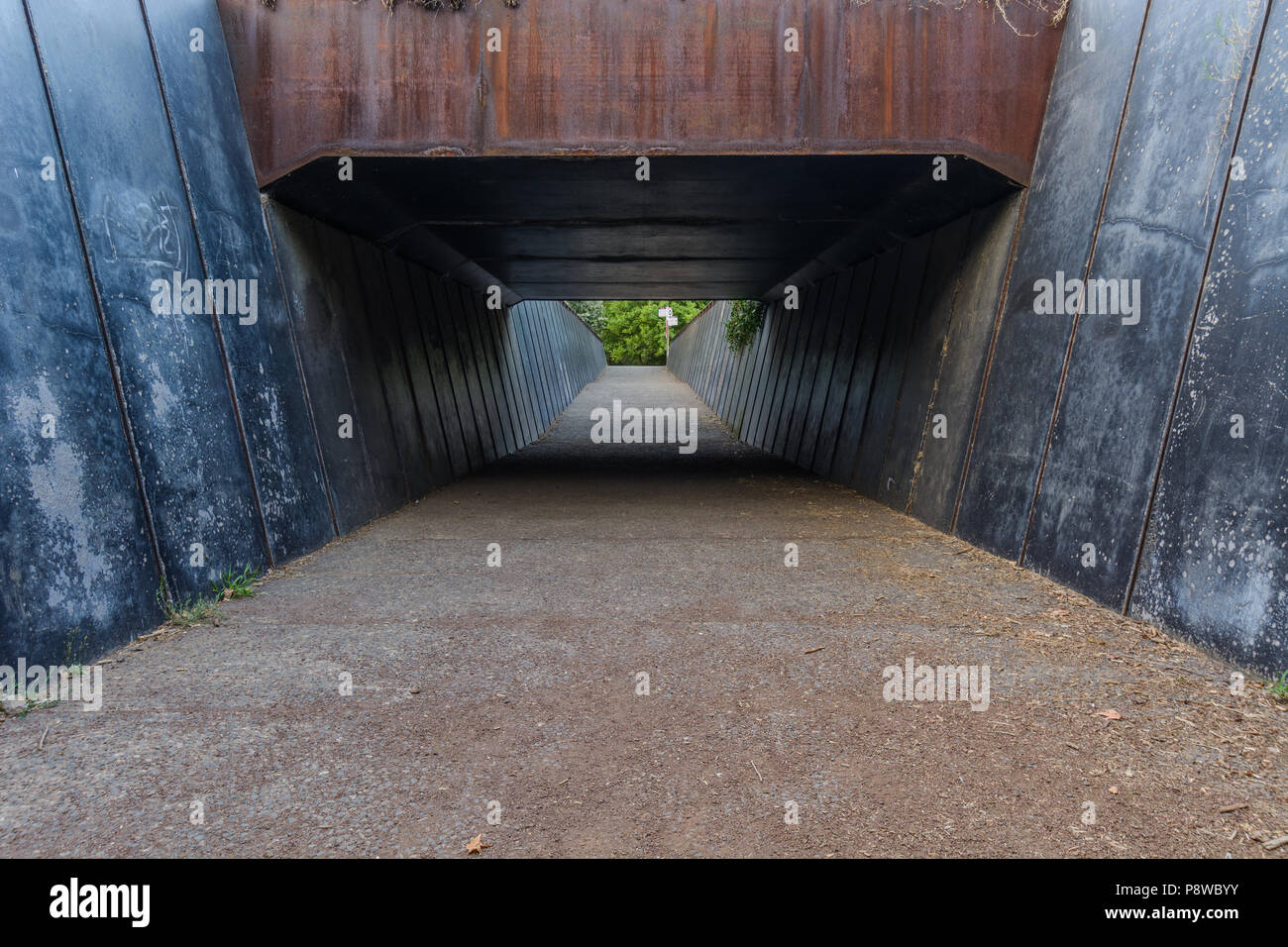 The entrance to a metal tunnel with its blue walls & garnet ceiling ...