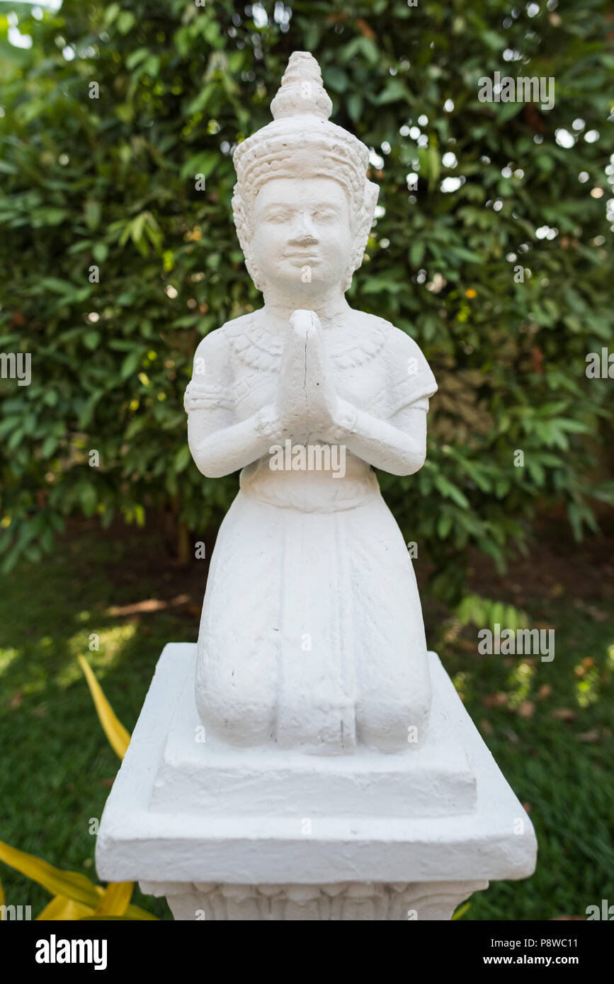 The white kneeling praying statue at Phnom Penh's Royal Palace ...