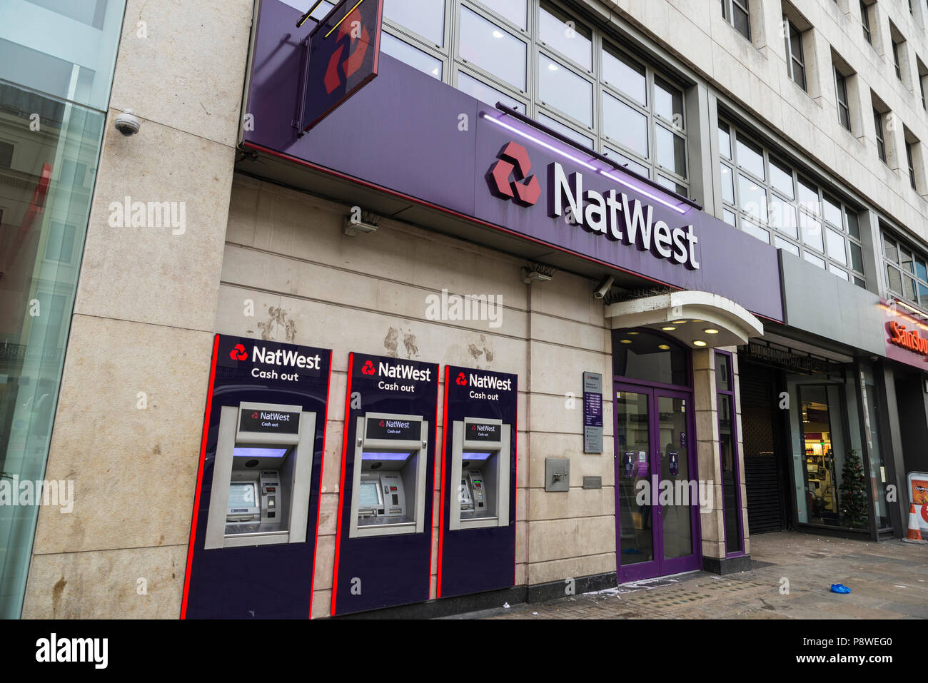 London, United Kingdom - January 1, 2017: Bank branch and three ATM of ...