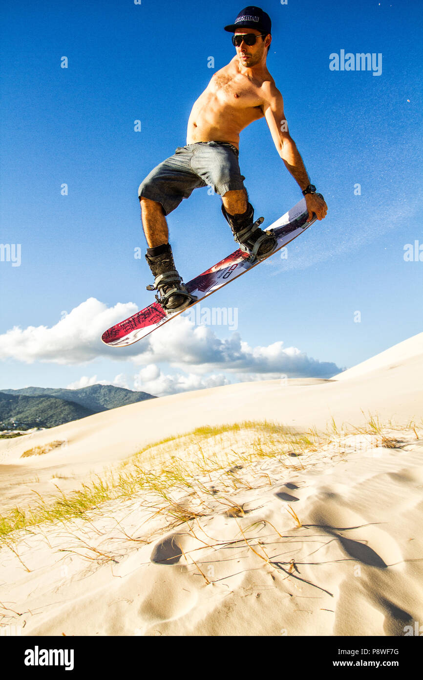 Sandboarding on the dunes of Joaquina Beach. Florianopolis, Santa ...