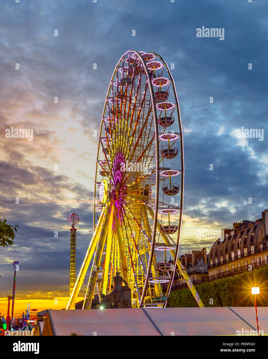 The popular icon observation Wheel in Paris of France at sunset near ...
