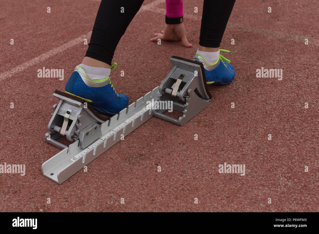 Female athletic ready for the race at running track Stock Photo - Alamy