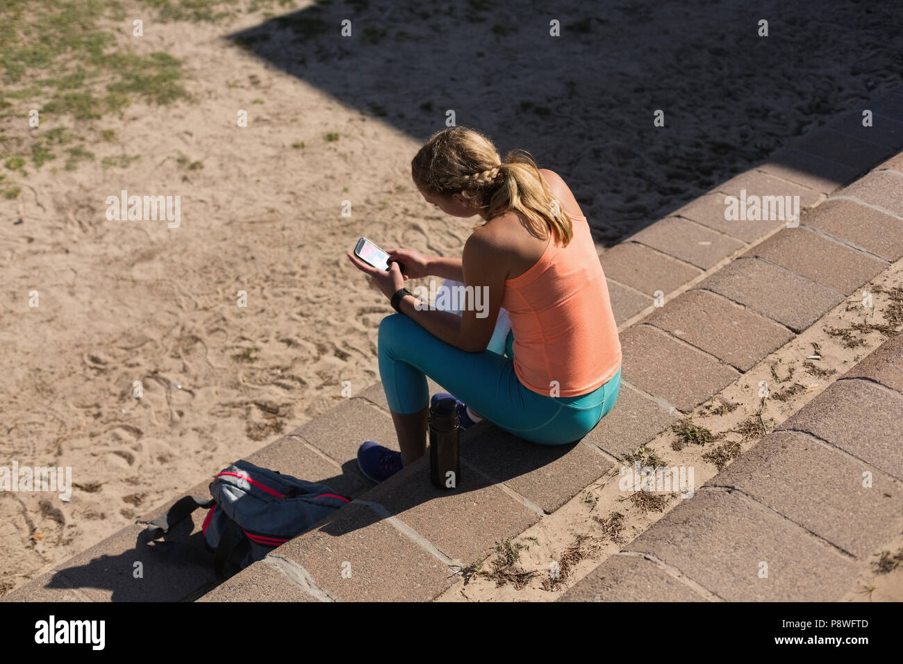 Female athlete using mobile phone Stock Photo - Alamy