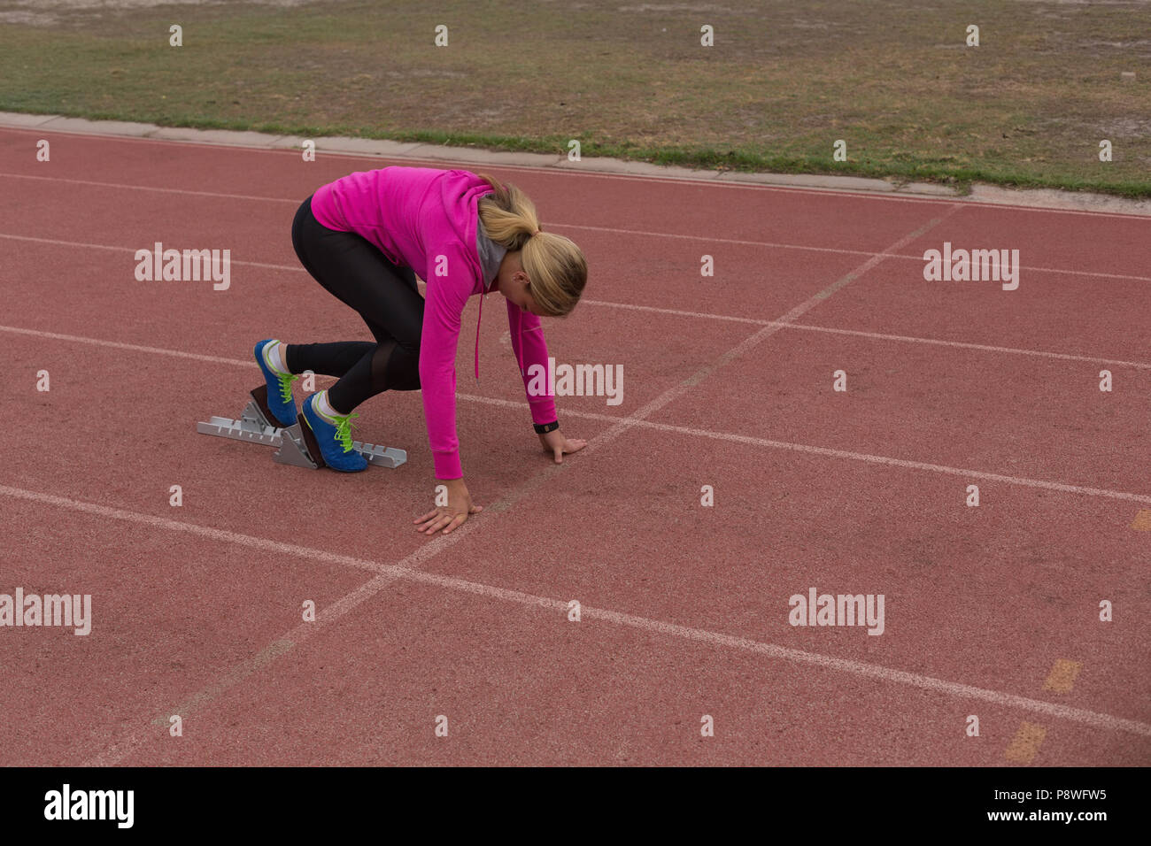 Female athletic ready for the race on the track Stock Photo - Alamy