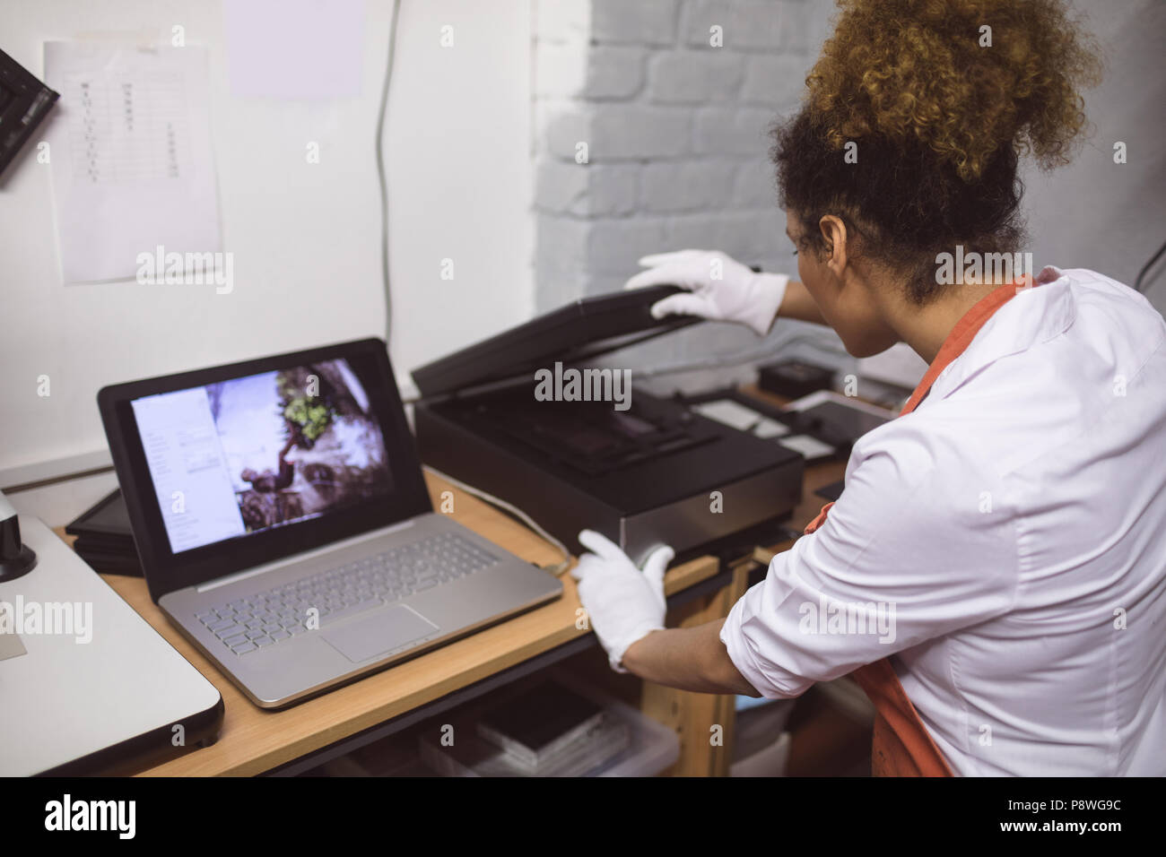 Female photographer using photo scanner Stock Photo - Alamy