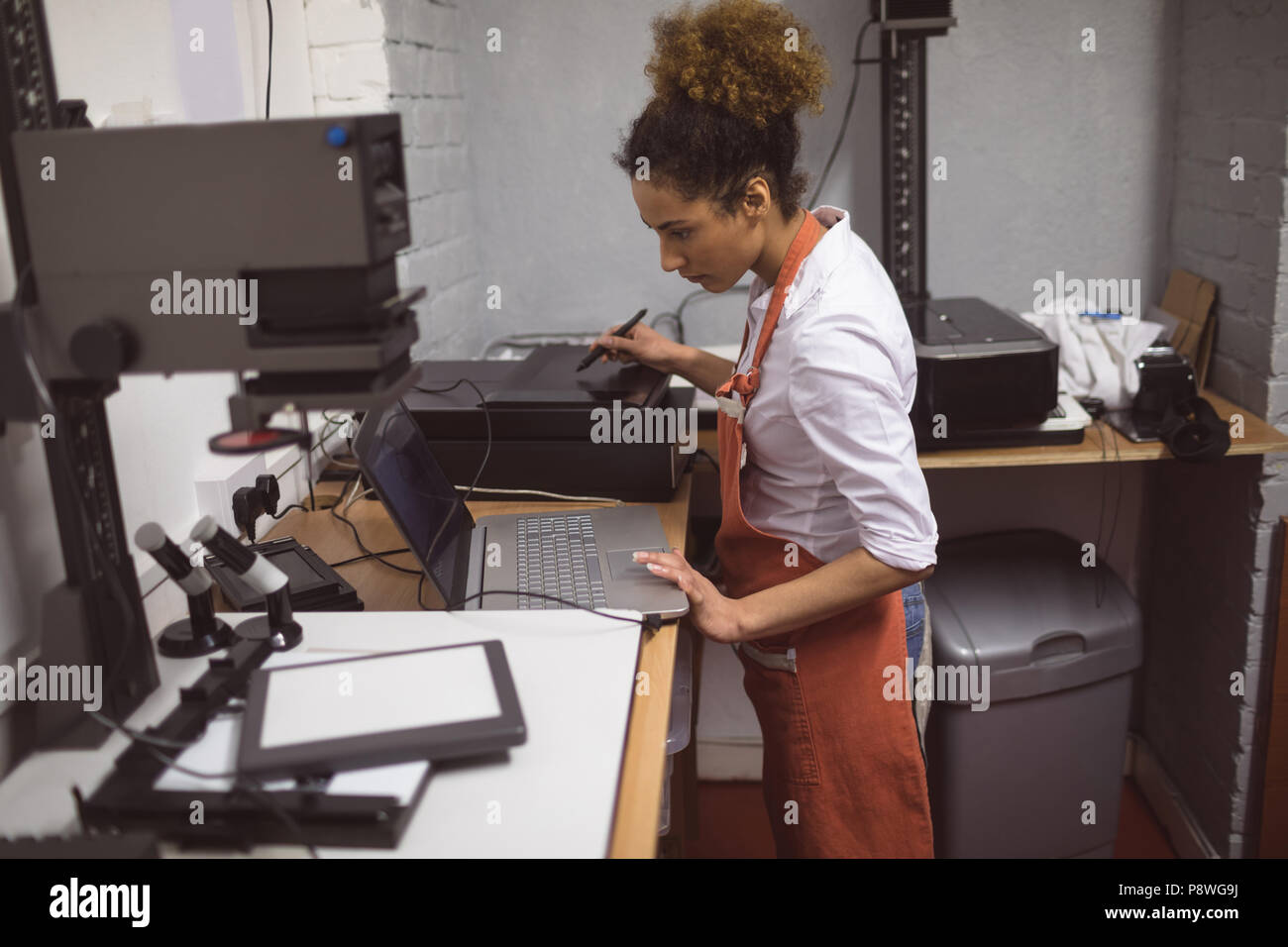 Female photographer developing photos Stock Photo - Alamy
