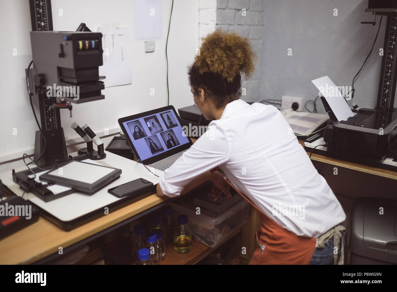 Female photographer developing photos Stock Photo - Alamy