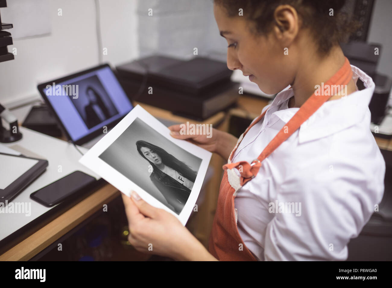Young female photographer holding hi-res stock photography and images ...