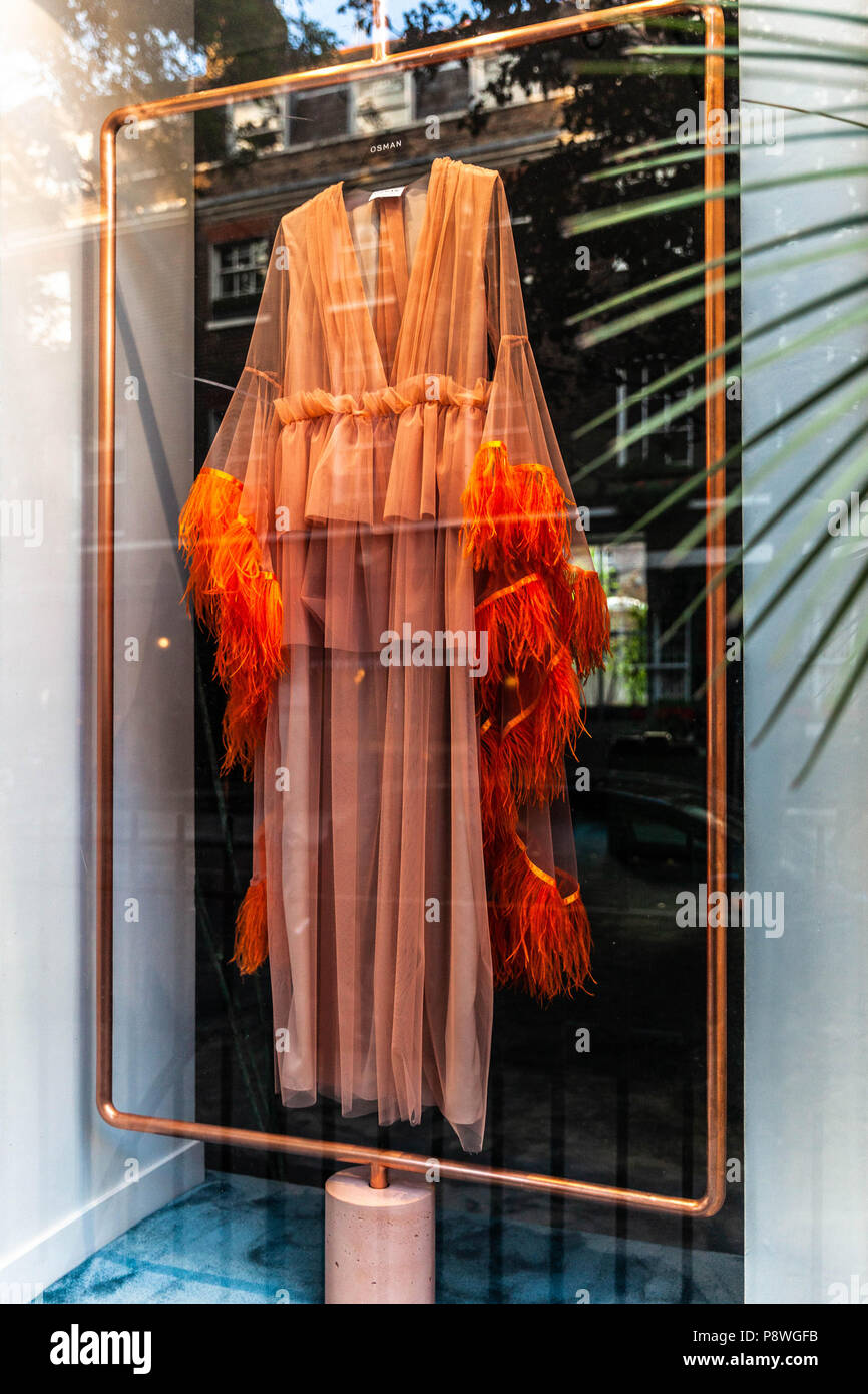 Exotic dress hanged inside a shop window, London, England, UK Stock ...