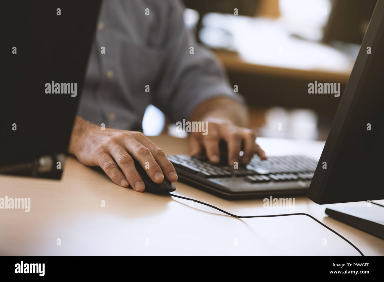 Business man"s hands typing away on computer keyboard Stock Photo - Alamy